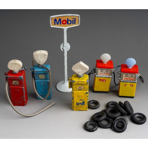 A collection of five die cast and plastic toy petrol pumps, the diecast ...