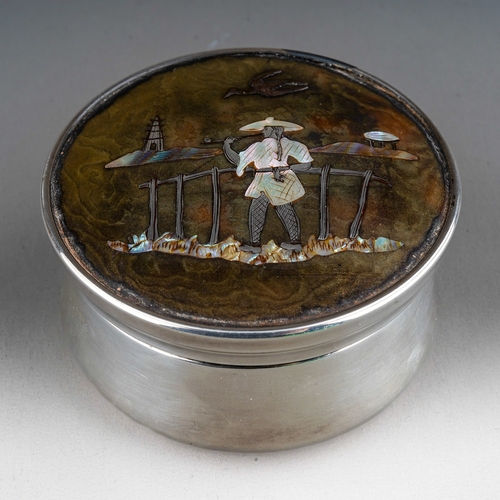 An Edwardian silver and tortoiseshell trinket box of circular form, the ...