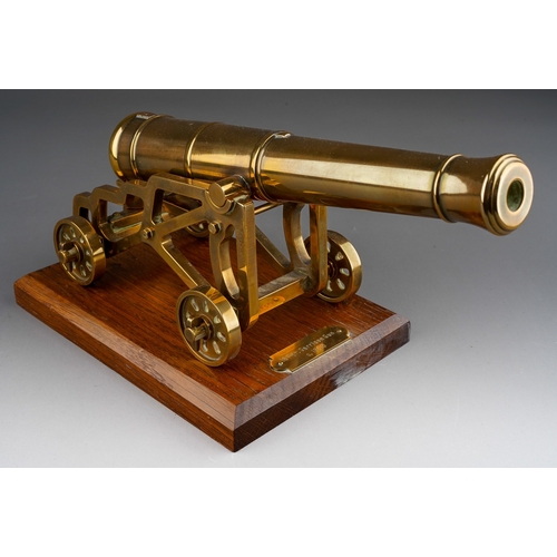 A brass model of a 18 Pdr. Garrison Gun from circa 1850, on oak base