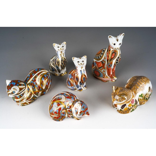 A collection of six loose Royal Crown Derby Cat paperweights, all with ...