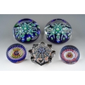 A Strathearn millefiori star shaped paperweight together with four ...
