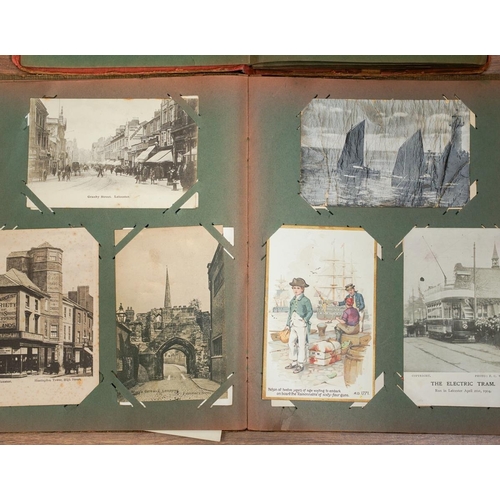 Two old time postcard albums containing approximately one hundred and ...