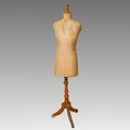 A first half 20th century dressmaker's mannequin, fabric covered upper ...