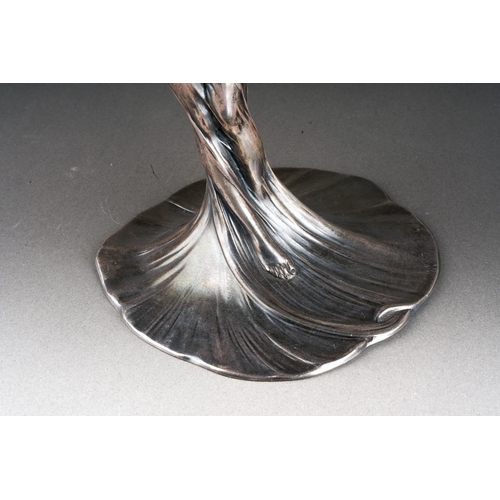 A pair of WMF Art Nouveau silvered pewter and brass candelabra, each ...