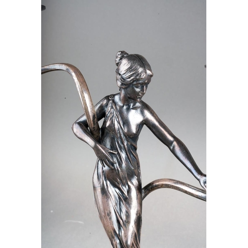 A pair of WMF Art Nouveau silvered pewter and brass candelabra, each ...