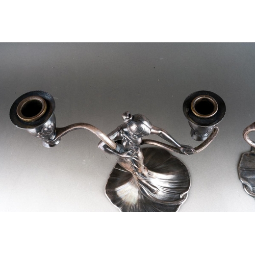 A pair of WMF Art Nouveau silvered pewter and brass candelabra, each ...