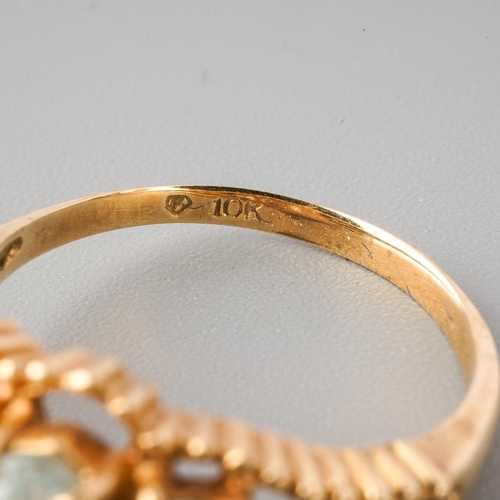 A gem set ring. Stamped 10k, approx ring size N, approx gross weight 2. ...