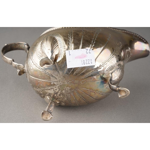A George III Irish silver sauceboat, embossed beaded rim, the sauceboat ...