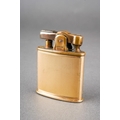 A vintage Ronson Dureum 9ct gold cased engine turned with central ...