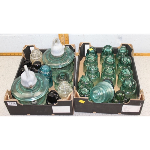 A large qty of assorted vintage glass electrical insulators, some with ...