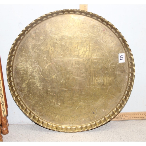 A vintage brass topped Benares folding tea table, approx 53cm in diameter