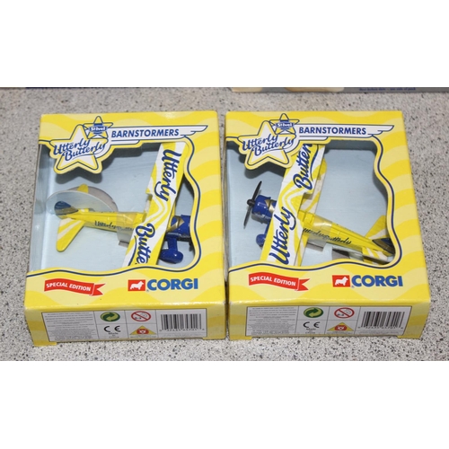 Qty of Lurpak collectables, 2 boxed egg cups and 2 Corgi bi-planes