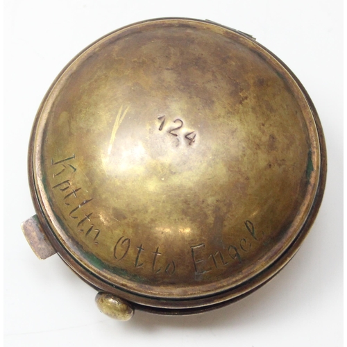 A German WW2 style brass watch case, known as a clam case, with applied ...
