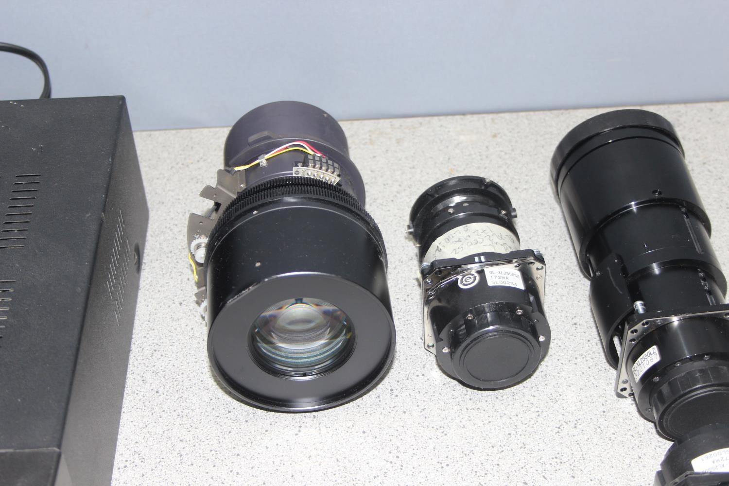 4 assorted camera lenses, a Sony DVD player and an Orion VHS player