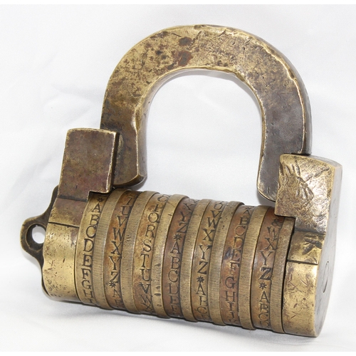 A rare and unusual cryptex style letter coded brass padlock with 7 ...
