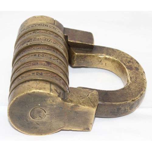 A rare and unusual cryptex style letter coded brass padlock with 7 ...