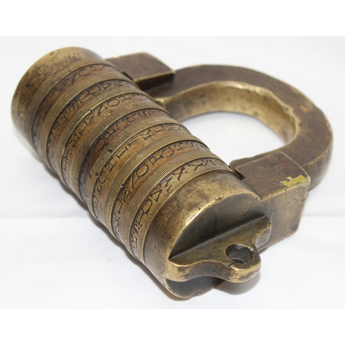A rare and unusual cryptex style letter coded brass padlock with 7 ...