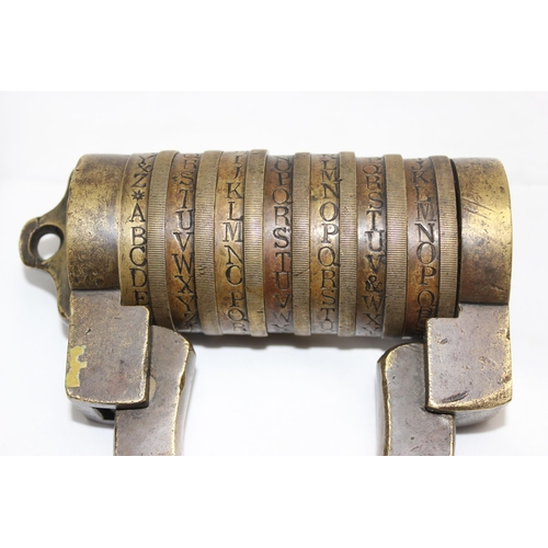 A rare and unusual cryptex style letter coded brass padlock with 7 ...