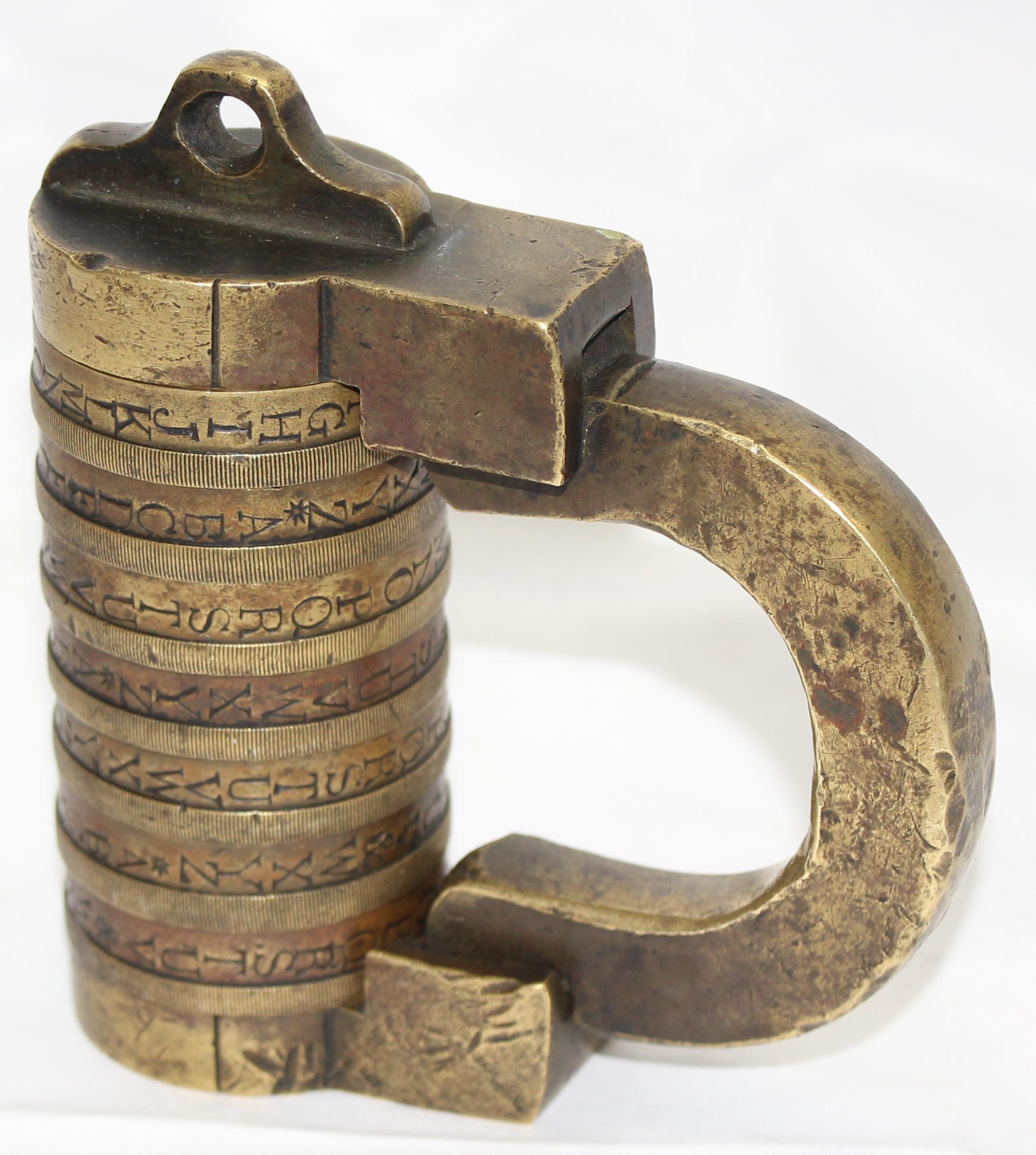 A rare and unusual cryptex style letter coded brass padlock with 7 ...