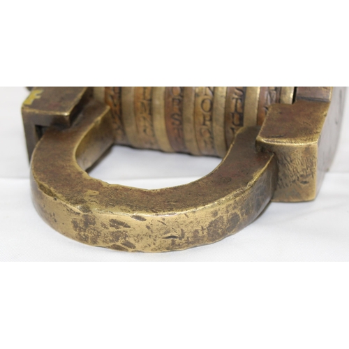 A rare and unusual cryptex style letter coded brass padlock with 7 ...