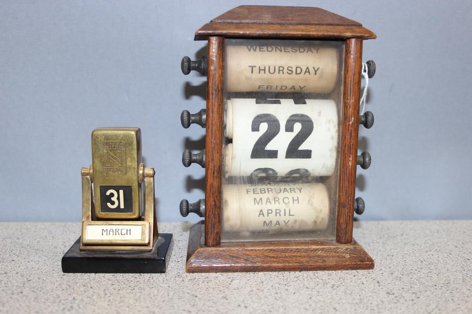 Antique perpetual desk calendar in oak glazed case and a smaller brass ...