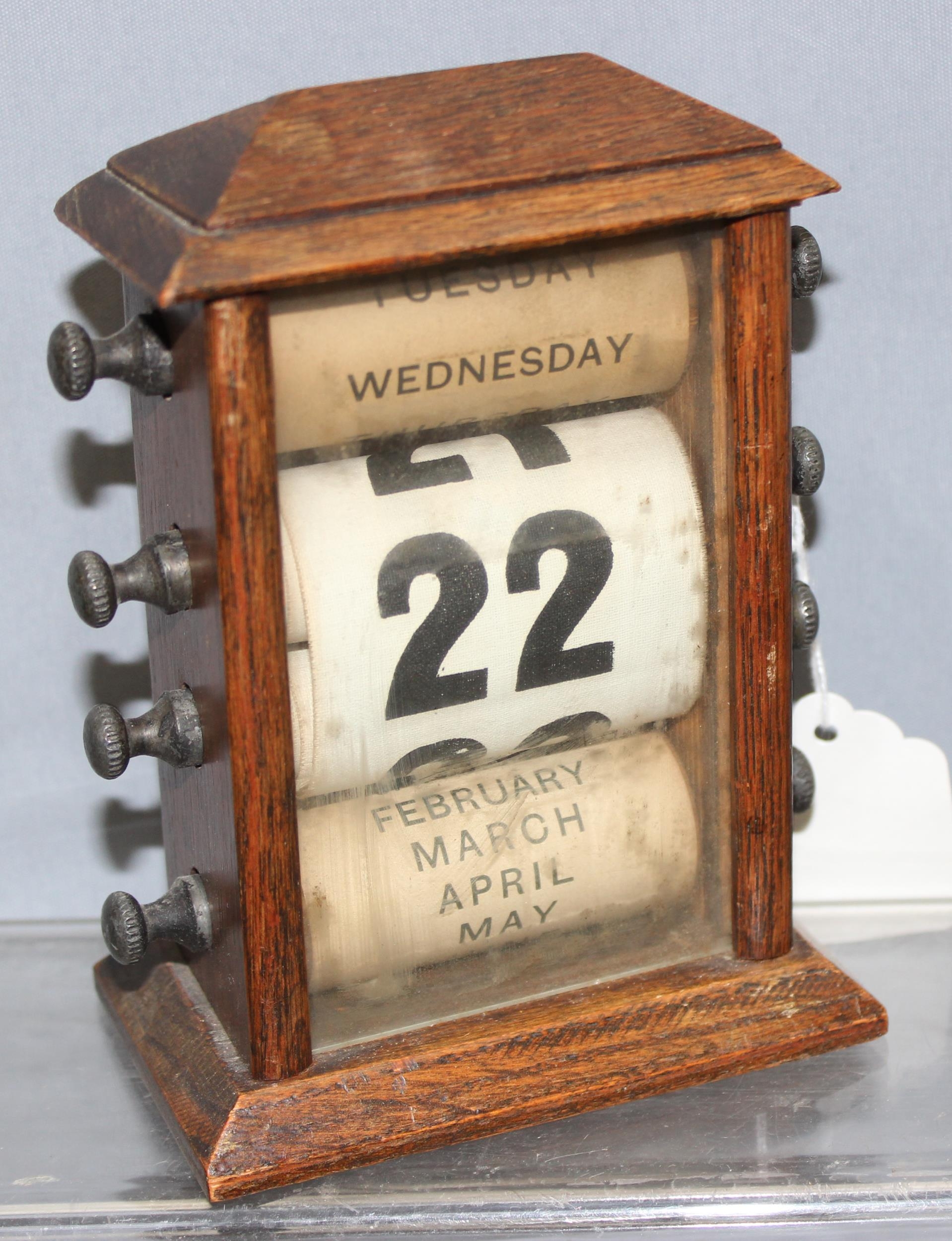 Antique perpetual desk calendar in oak glazed case and a smaller brass ...