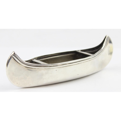 A Victorian novelty silver model of a canoe, possibly a pin cushion ...