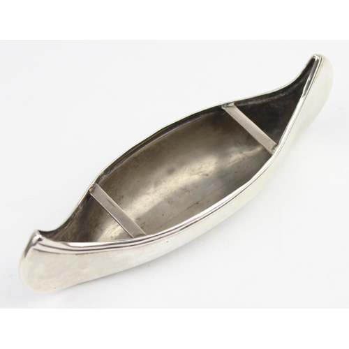 A Victorian novelty silver model of a canoe, possibly a pin cushion ...