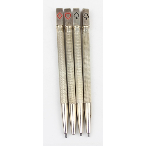 A boxed set of 4 silver and enamel bridge pencils, marked Sterling ...