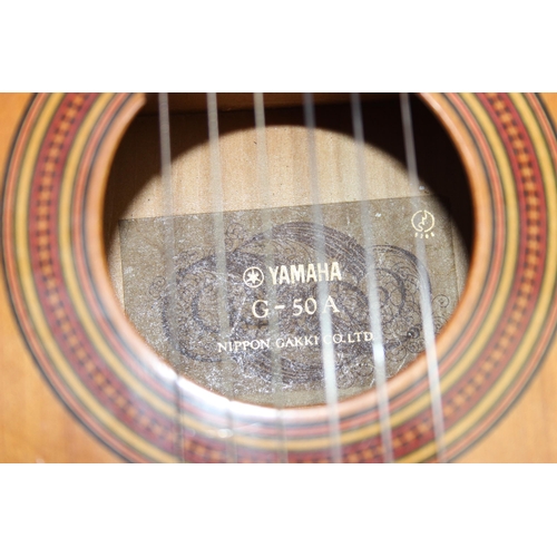 A vintage Yamaha G-50A acoustic guitar in case