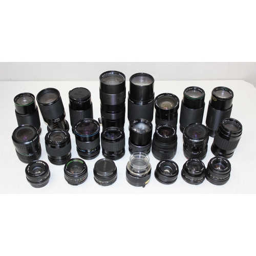 A large qty of assorted camera lenses, various models and fittings
