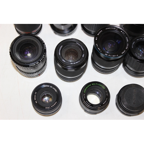 A large qty of assorted camera lenses, various models and fittings