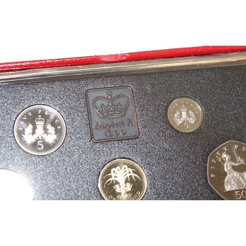 Ten assorted Royal Mint uncirculated proof coin sets in the luxury red ...