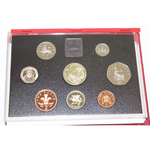 Ten assorted Royal Mint uncirculated proof coin sets in the luxury red ...