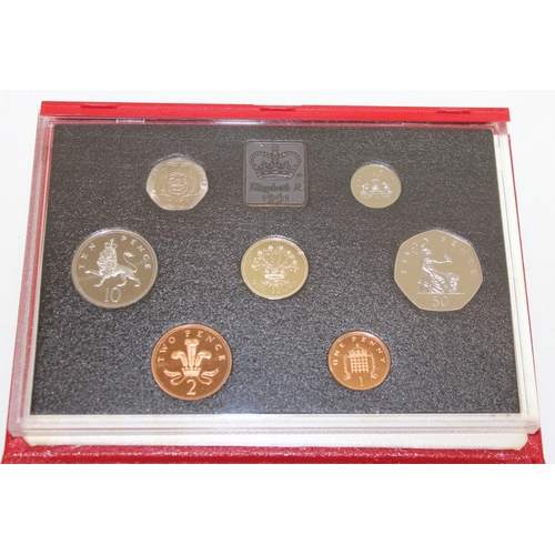 Ten assorted Royal Mint uncirculated proof coin sets in the luxury red ...