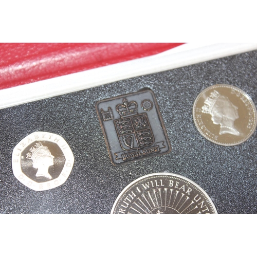 Ten assorted Royal Mint uncirculated proof coin sets in the luxury red ...