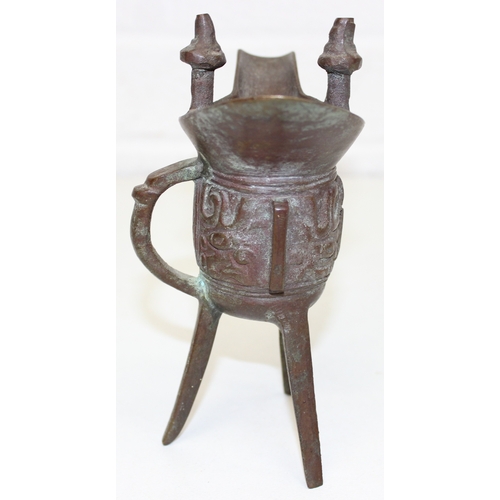 A Chinese metal libation cup, Chueh type of Shang Dynasty style, made ...