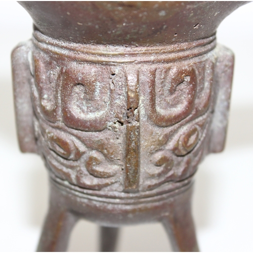 A Chinese metal libation cup, Chueh type of Shang Dynasty style, made ...