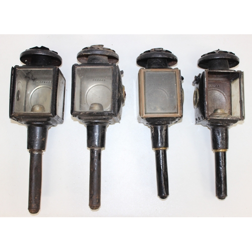 Four black painted metal carriage lamps, the largest 44cm tall [4]