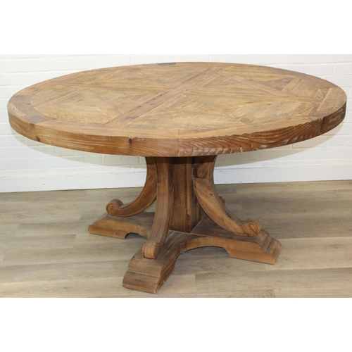A large reclaimed pine circular library table with decorative base ...
