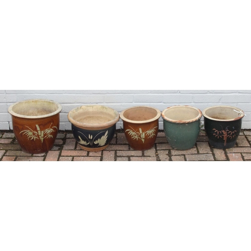 Five various garden pots with incised or impressed patterns, to include ...