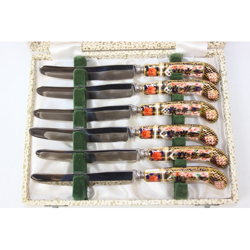 A boxed set of six Royal Crown Imari pattern butter knives, each with a ...