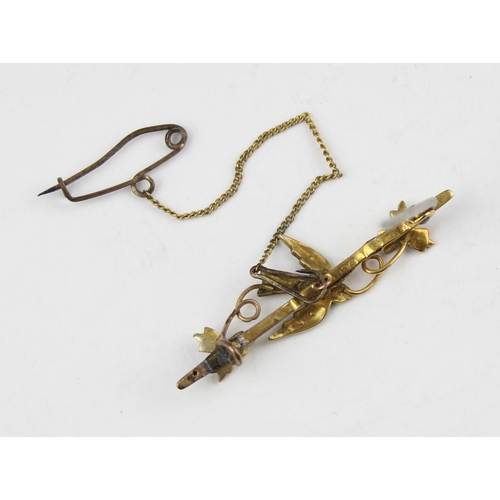 [1.81g] - a Victorian 9ct gold and seed pearl brooch formed as a swift or swallow, marked 9ct and XR