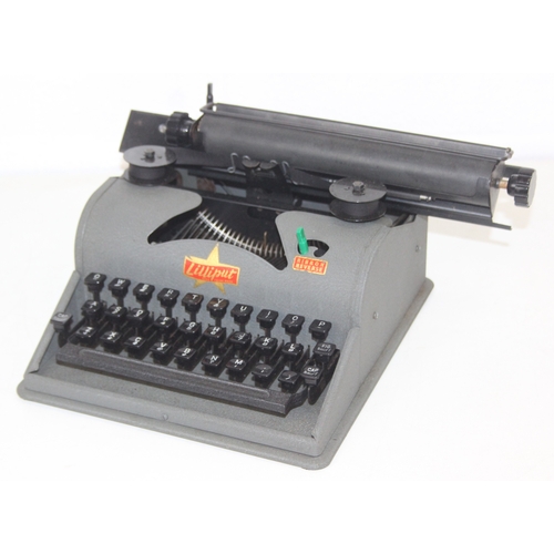 A vintage Lilliput child's toy typewriter