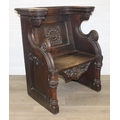 An interesting carved oak pew or chair, ornate carving including crown ...