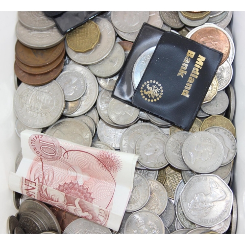 A large qty of assorted mixed coins and coin related items, mainly ...