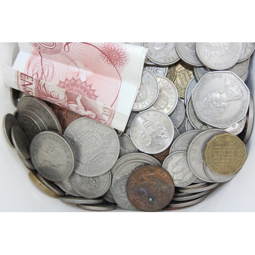 A large qty of assorted mixed coins and coin related items, mainly ...
