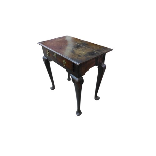 An early Georgian oak lowboy, with brass drop handles, cabriole legs ...