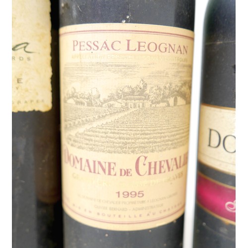 Four bottles of red wine including Domaine de Chevalier Grand Cru ...