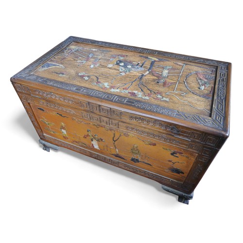 A mid 20th century Chinese camphor wood chest, with relief carved top ...